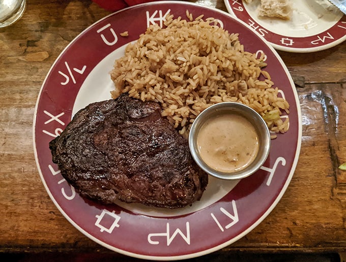 The ribeye arrives with a gorgeous char that promises flavor in every single bite you take tonight.