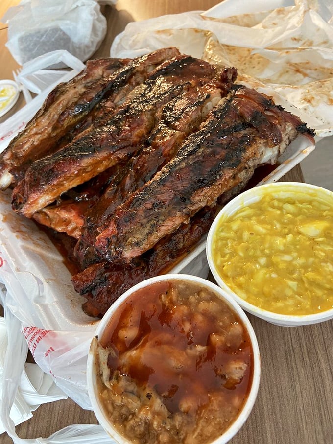 These ribs aren't just smoked, they're transformed. The bark on that meat tells a story of patience, fire, and barbecue wisdom.