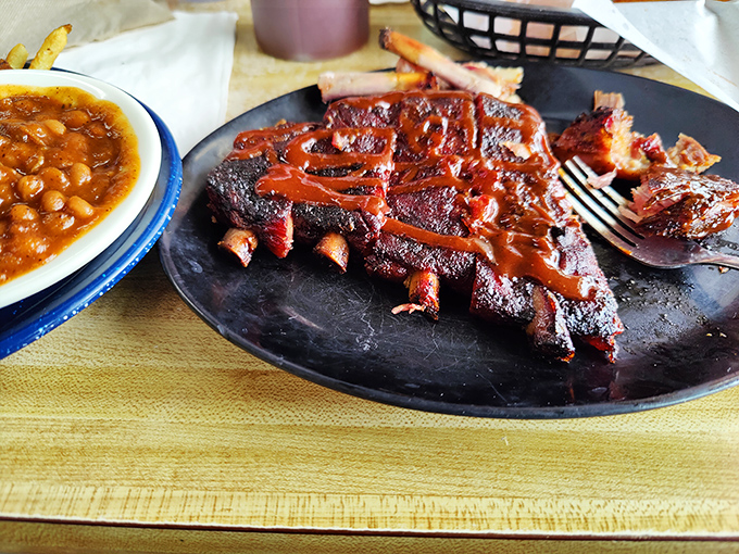 These ribs aren't just falling off the bone &ndash; they're practically jumping into your mouth with a perfect bark and that glistening sauce.