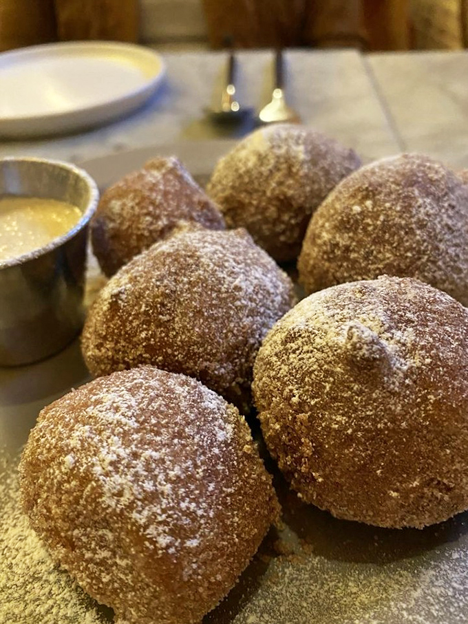 Sugar-dusted ricotta fritters that would make your Italian grandmother weep with joy. Crisp exterior, cloud-like interior&mdash;dessert perfection.