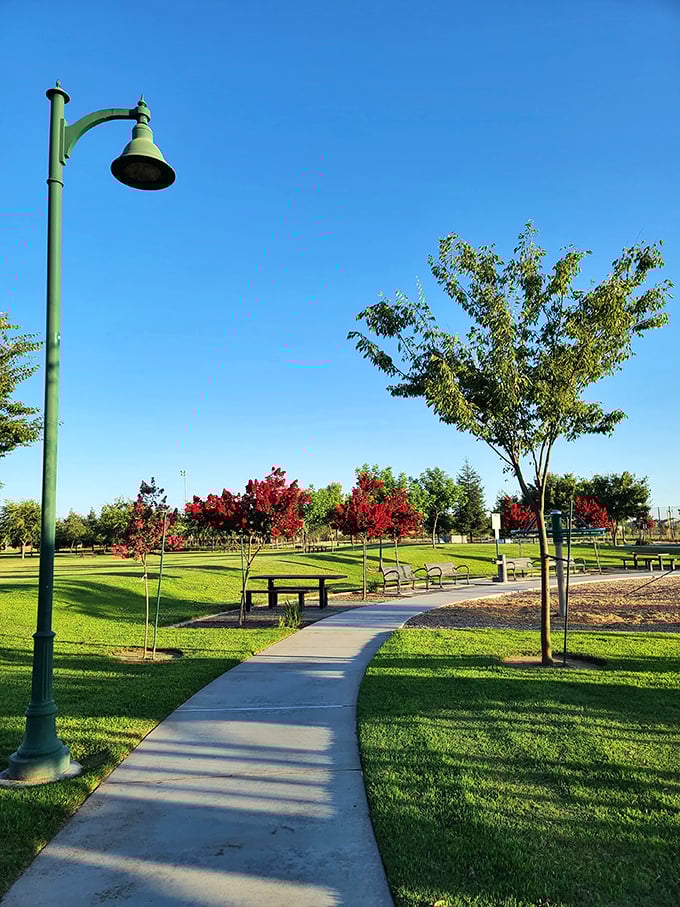 Riverway Sports Park's walking paths wind through meticulously maintained greenery, proving that sometimes the best workout comes with the best views.