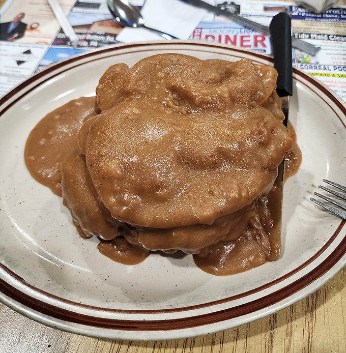 Comfort food royalty: tender pot roast drowning in rich gravy. The kind of meal that makes you want to hug whoever's in the kitchen.