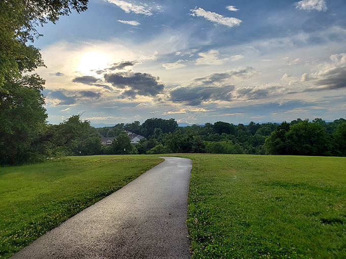 Rockwater Park's winding path invites contemplative strolls beneath skies that seem to have been ordered from a premium catalog of perfect weather.