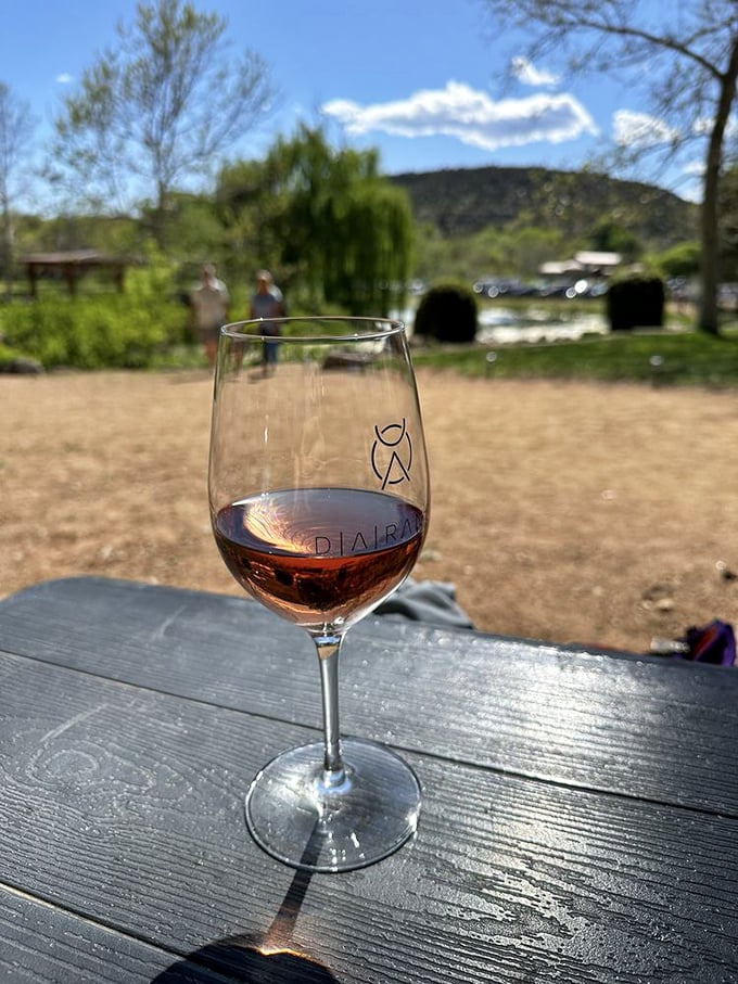 A glass of ros&eacute; catching the Arizona light&mdash;proof that sometimes the most beautiful views come in stemware.