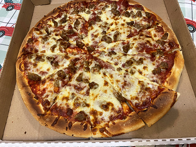 Pizza perfection doesn't need to shout &ndash; this sausage pie speaks volumes with its golden crust, bubbling cheese, and generous toppings that mean business.