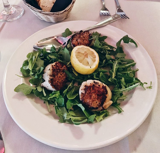 Perfectly seared scallops rest on a bed of peppery arugula. Simple, elegant, and exactly what Italian cooking is all about.