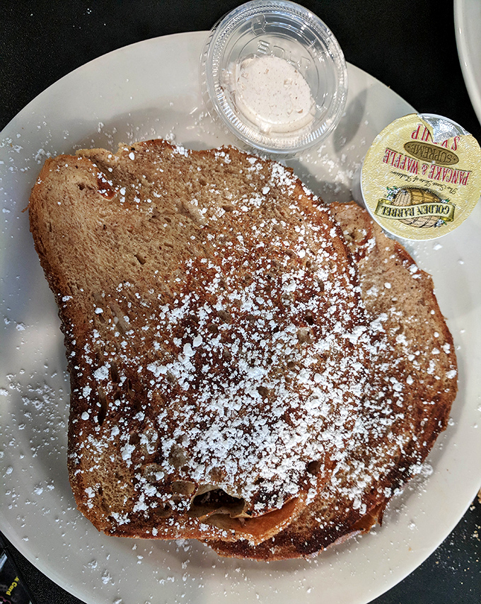 This grilled banana bread dusted with powdered sugar isn't just breakfast &ndash; it's what angels eat when they're feeling particularly deserving.