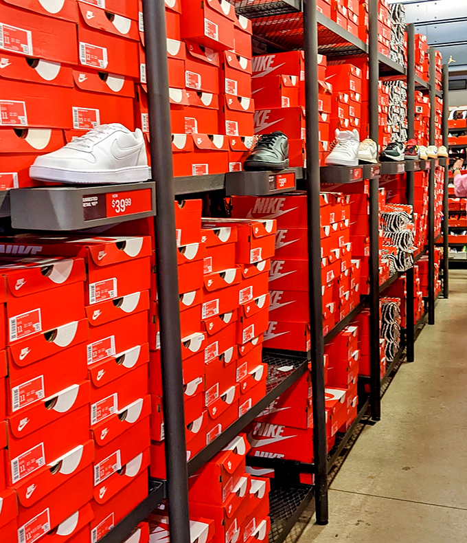 The Nike outlet's wall of red boxes resembles a sneakerhead's version of heaven &ndash; or what my closet would look like if my spouse didn't intervene.