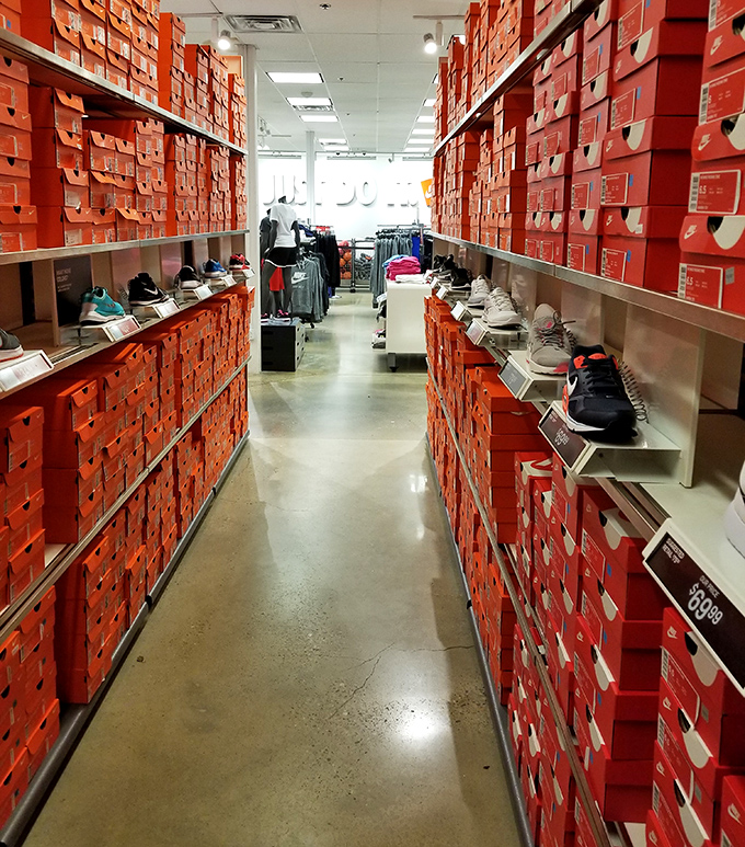 The Nike outlet's "wall of boxes" &ndash; a monument to athletic aspiration where even the most casual jogger feels like an Olympian in training.