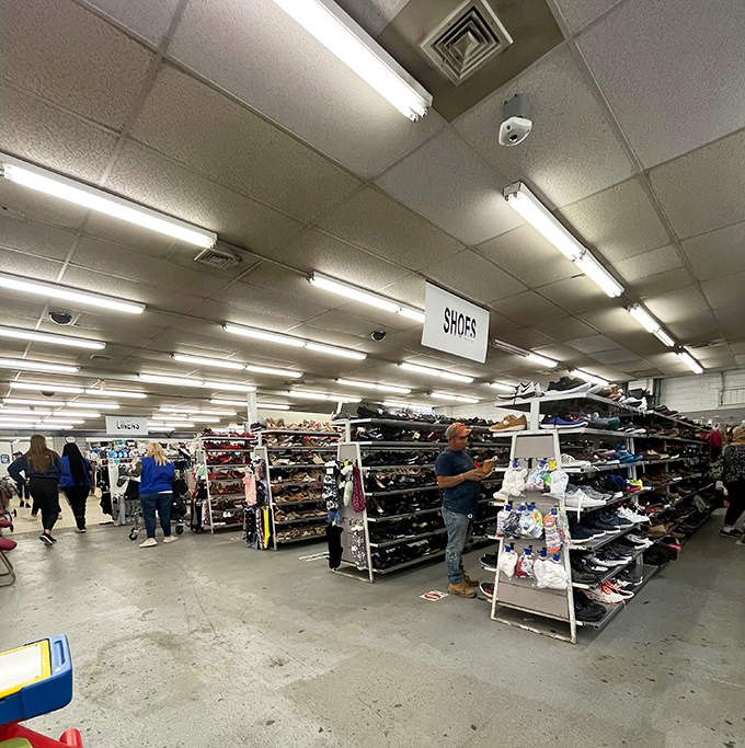 The shoe department draws serious browsers scanning for hidden gems. That focused expression? It's the universal "I think I just found Italian leather for $8" face.