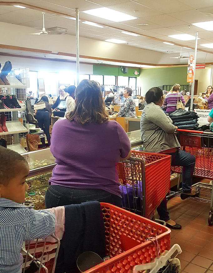 The checkout line: where strangers become temporary comrades united by the thrill of the hunt and the universal language of a good bargain.