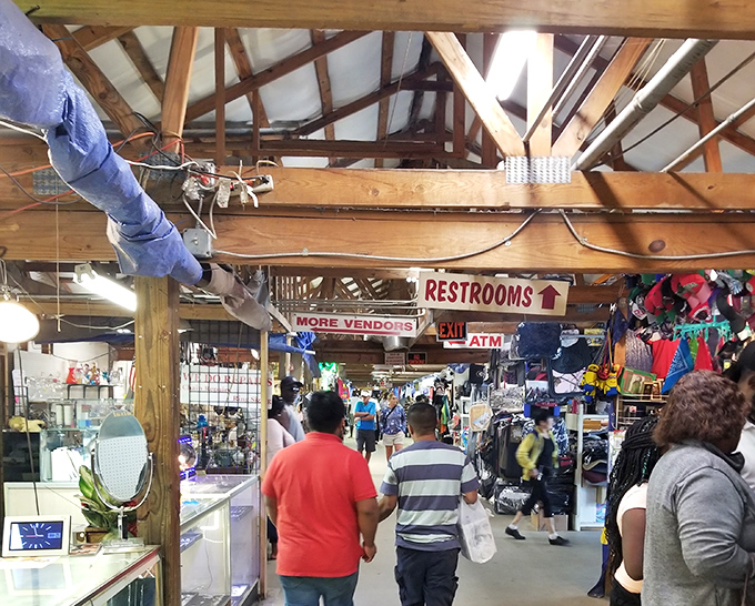 The indoor marketplace buzzes with activity as shoppers navigate the labyrinth of vendors. That "More Vendors" sign isn't kidding&mdash;prepare to lose track of time!