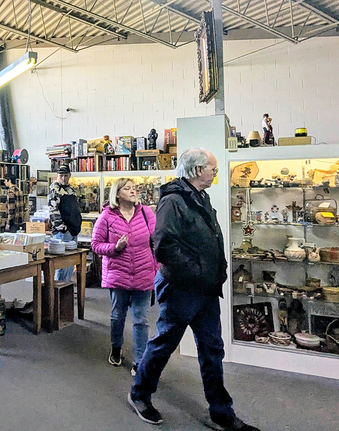 The true antique experience: shoppers lost in thought, mentally rearranging their living rooms to accommodate potential treasures.