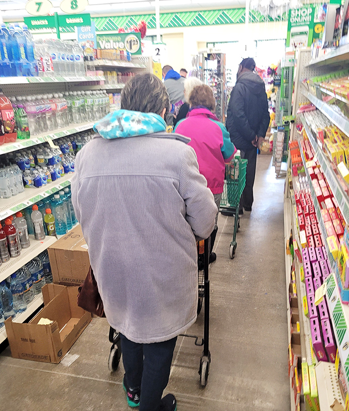 The grocery aisle on a busy day looks like a Wisconsin family reunion – everyone's welcome and nobody leaves empty-handed.
