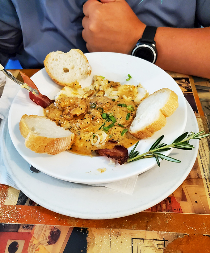 Their shrimp and grits isn't just a dish&mdash;it's a masterclass in texture and flavor that makes you understand why people line up outside in the Louisiana heat.