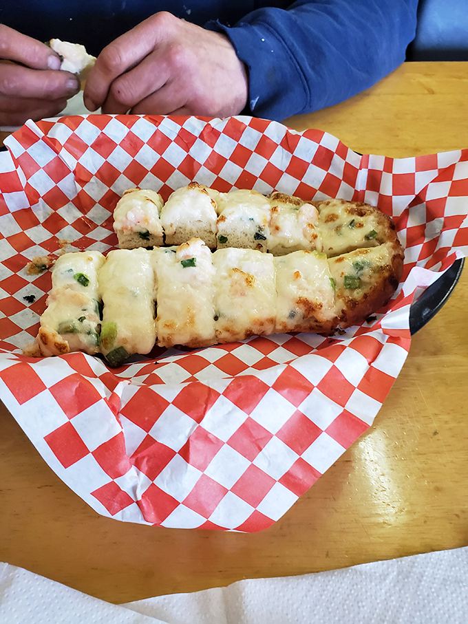 This isn't just bread&mdash;it's a cheese-laden seafood vessel that makes you wonder why all bread doesn't come dressed this magnificently.