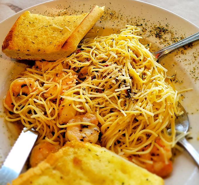 Shrimp scampi that would make an Italian grandmother weep with joy&mdash;tender crustaceans swimming in buttery pasta paradise with garlic bread standing by for sauce-sopping duty.