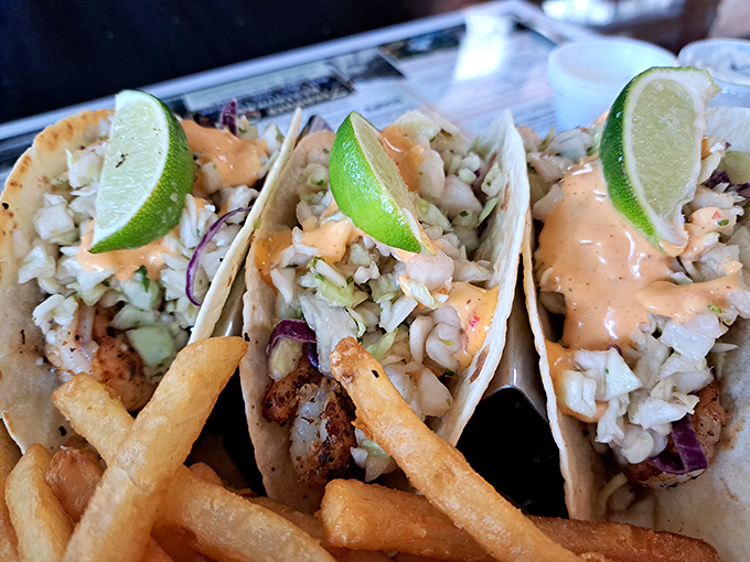 These seafood tacos aren't just a meal, they're a coastal vacation wrapped in a tortilla &ndash; complete with zesty lime and that sauce you'll be dreaming about tomorrow.