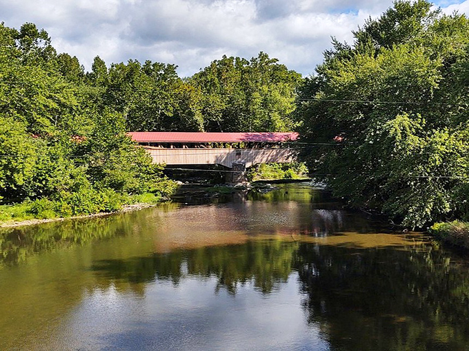 Some bridges connect banks; this one connects centuries. The reflection in Tuscarora Creek doubles the visual pleasure for lucky visitors.