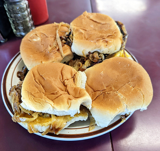 The proper way to order at Powers: in multiples. These sliders aren't just burgers; they're edible history on a soft bun.