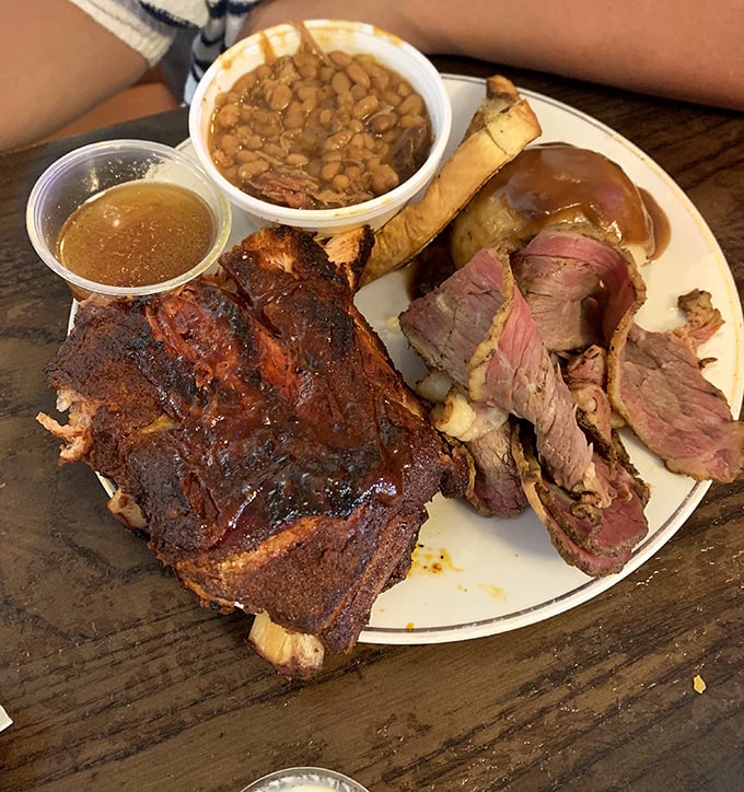 Barbecue nirvana on a plate – ribs with that perfect smoke ring, prime cuts with a bark that should be illegal, and sides that don't know they're supposed to be supporting actors.