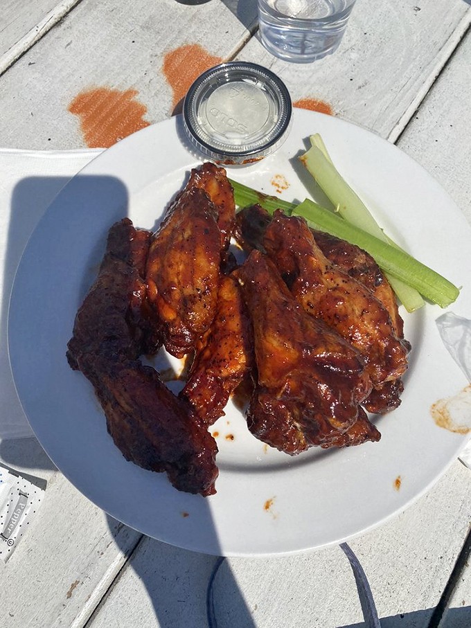These wings aren't just smoked, they're transformed&mdash;glistening with sauce and accompanied by cooling celery. Finger-licking mandatory.