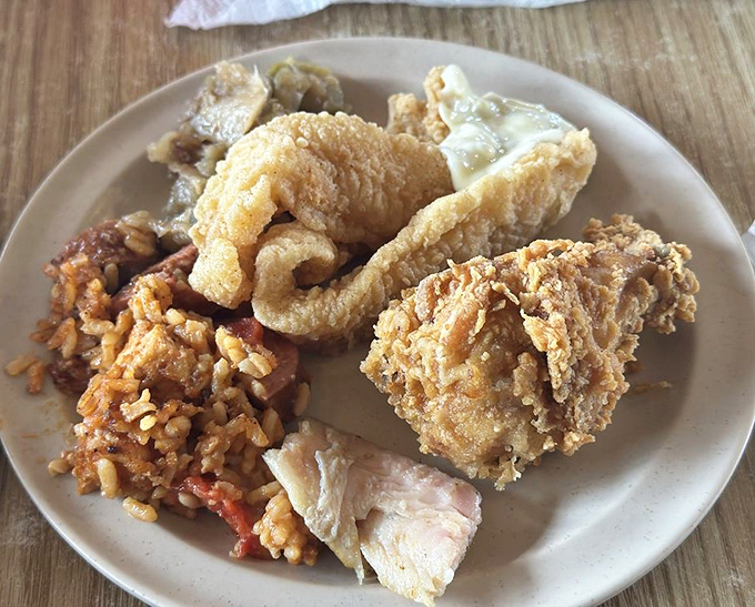 This isn't just a plate&mdash;it's a Southern symphony. Crispy fried treasures alongside jambalaya that would make your Louisiana grandmother weep with pride.