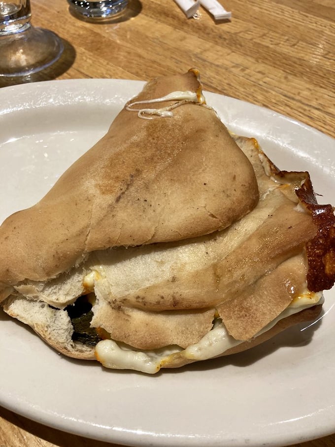 This pita pocket isn't just stuffed &ndash; it's having an existential crisis about containing all that melty goodness without surrendering to gravity.