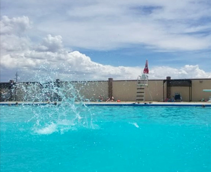 Splashland's turquoise waters offer a refreshing escape from summer heat. Nothing says "I'm on vacation" like the sound of joyful splashes against a backdrop of mountain peaks.