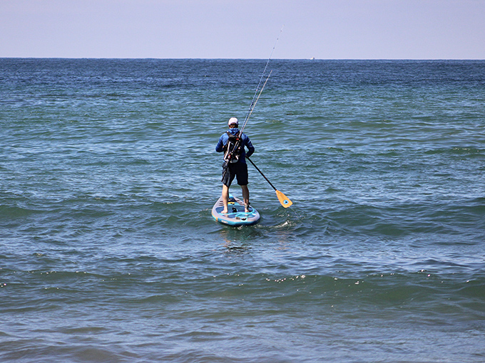 "Office views" don't get better than this &ndash; a lone paddleboarder finds solitude and perhaps a few fish on Terramar's crystal waters.