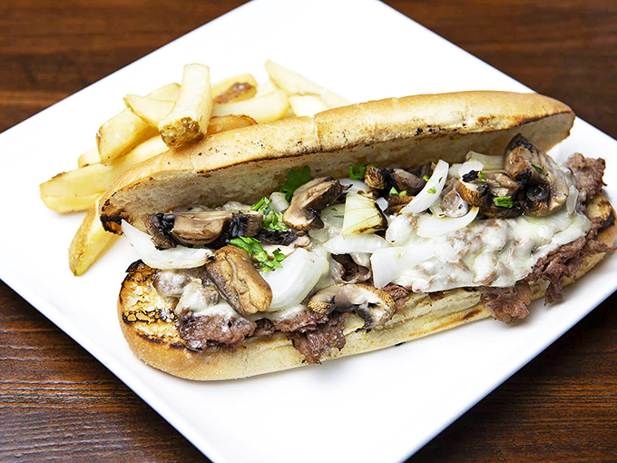 Not just a sandwich but an architectural marvel&mdash;layers of steak, mushrooms, and melted cheese creating the Taj Mahal of lunch options.