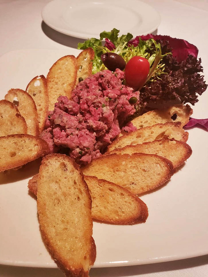 The steak tartare arrives like a crown jewel surrounded by crisp crostini&mdash;raw beef never looked so civilized or tasted so divine.