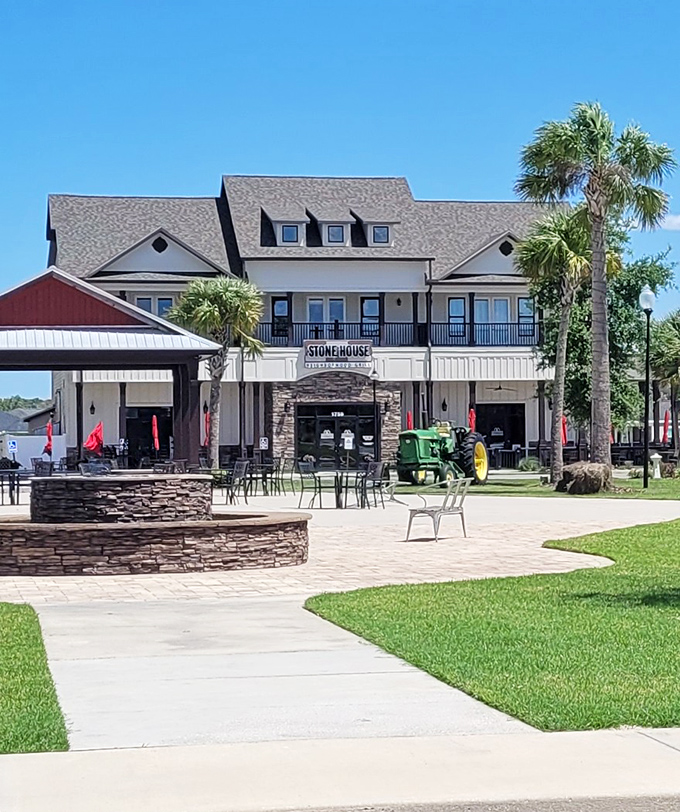 The Stone House Neighborhood Grill stands as proof that Florida retirement doesn't mean sacrificing good architecture or outdoor dining under swaying palms.