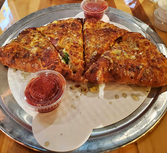 The stromboli at Roosters Roost doesn't just bend the rules of physics&mdash;it creates its own delicious dimension where cheese stretches into infinity.