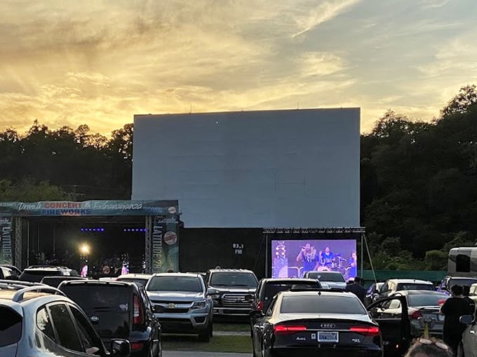 That moment between day and night when the screen awaits its moment to shine, while pickup trucks stake out prime viewing spots.