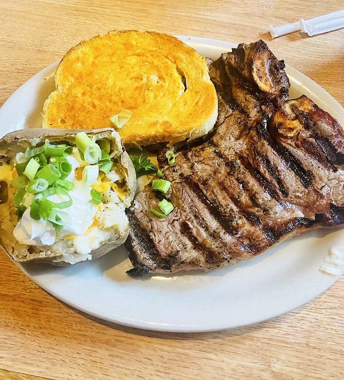 This T-bone doesn't mess around – flanked by a golden cheese toast that could make a vegetarian reconsider their life choices.