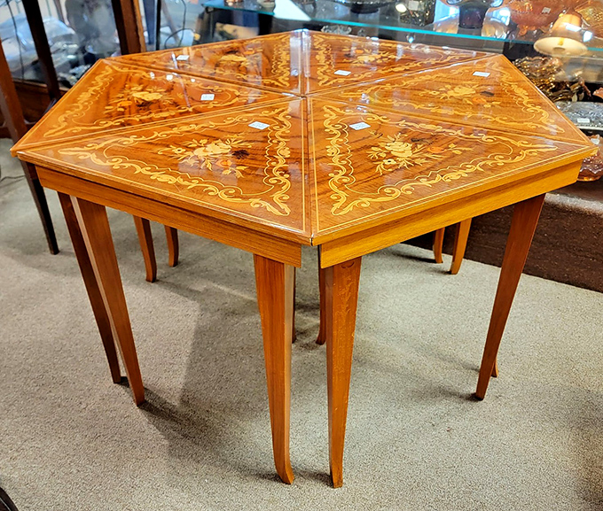 This isn't just a table&mdash;it's functional art. Inlaid wood creates patterns that would make Italian craftsmen nod in approval.