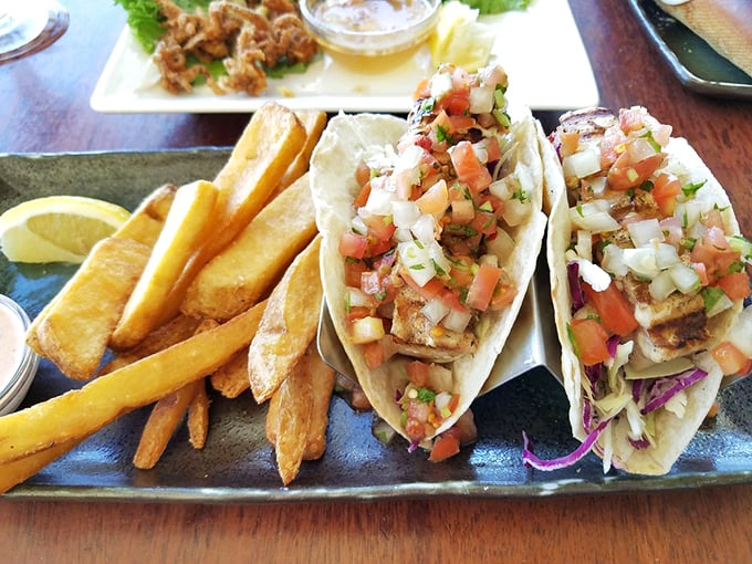 Fish tacos that make you question every mainland version you've ever eaten. Fresh, vibrant, and served with fries that deserve their own fan club.