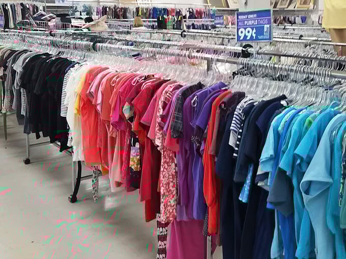 A rainbow of clothing organized by color, because finding your size is half the fun of the hunt.