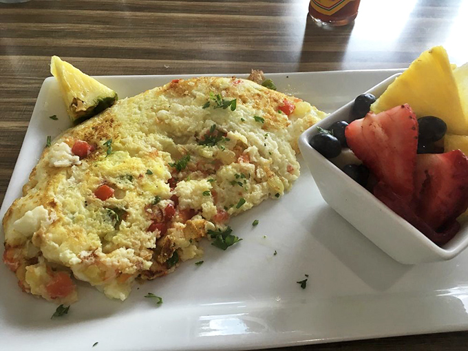 This isn't just an omelet; it's a colorful canvas of fresh ingredients that makes ordinary eggs seem like they're not even trying.