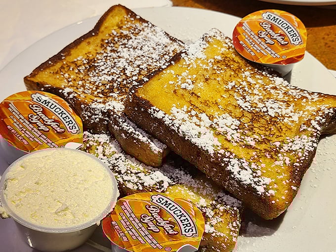 French toast that's dressed for success with a dusting of powdered sugar and enough maple syrup cups to satisfy even the most dedicated sweet tooth.