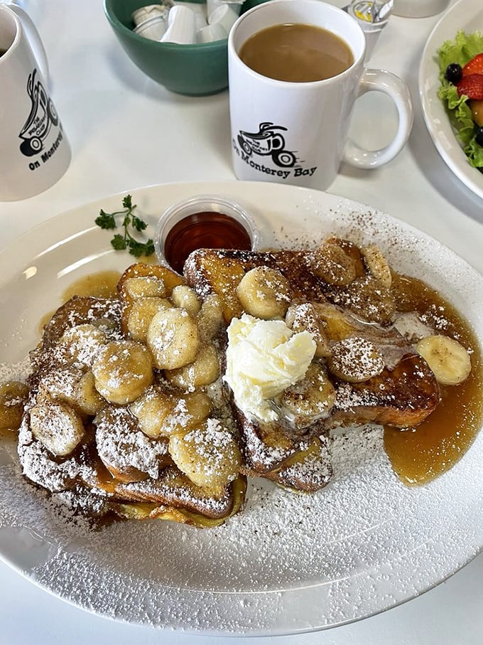 Banana-topped French toast that would make Elvis weep with joy. The powdered sugar snowfall and syrup river create breakfast nirvana.