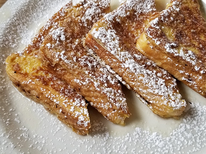 French toast that dressed up for the occasion. That powdered sugar dusting isn't just for show&mdash;it's the formal attire for a breakfast celebrity.