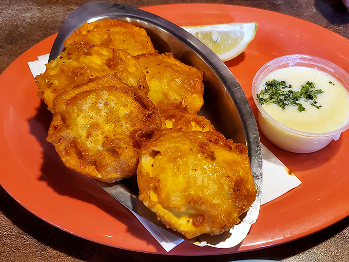 Golden-fried corn fritters that crunch like autumn leaves, revealing a pillowy interior that would make even a New Orleans chef tip their hat.