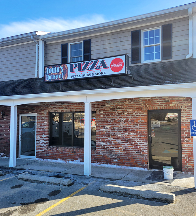 Toula's House of Pizza &ndash; where the neon sign promises exactly what you need after a long day: comfort food that doesn't require a second mortgage.