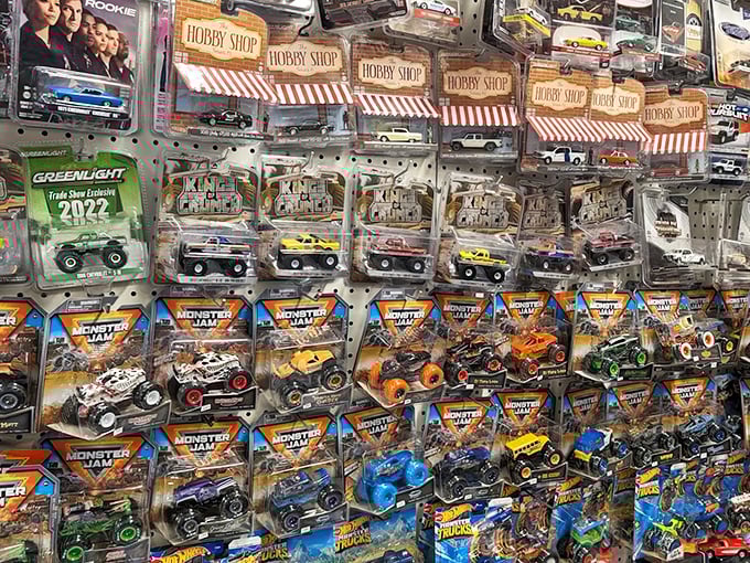 Toy cars lined up with military precision, each tiny vehicle carrying a payload of nostalgia powerful enough to transport grown men back to childhood Saturday mornings.