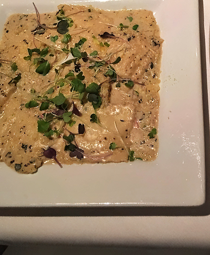 Truffle ravioli that whispers rather than shouts, allowing the earthy fungal notes to dance delicately with fresh herbs in perfect harmony.