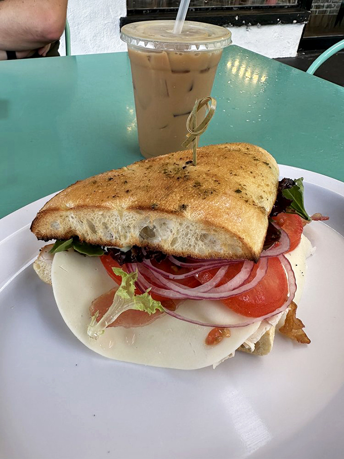 The Turkey Club arrives like a skyscraper of flavor, with layers of fresh ingredients that make you wonder why you ever settled for drive-thru sandwiches.