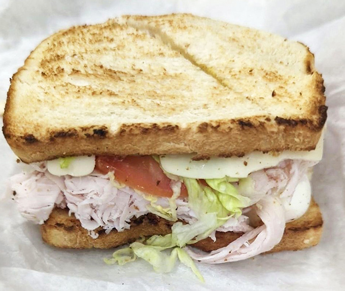 Layer upon layer of thinly sliced turkey, fresh vegetables, and perfectly toasted bread. This isn't just lunch&mdash;it's what bread dreams about becoming when it grows up.