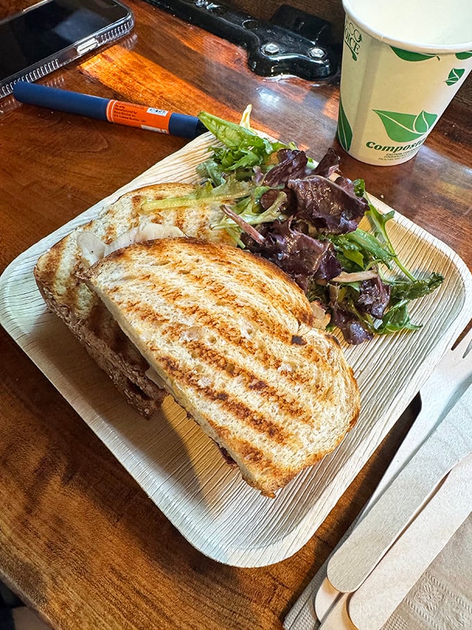 A perfectly grilled sandwich with fresh greens on the side&mdash;proof that Butterscotch Pastry Shop knows lunch isn't just the opening act before dessert.